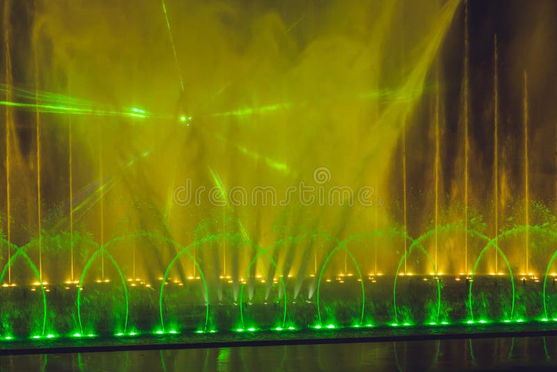 Multicolored Dancing Water Jet Fountain in the Dark Stock Photo - Image ...
