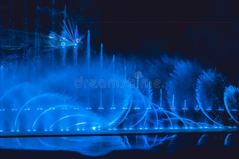 Multicolored Dancing Water Jet Fountain in the Dark Stock Image - Image ...
