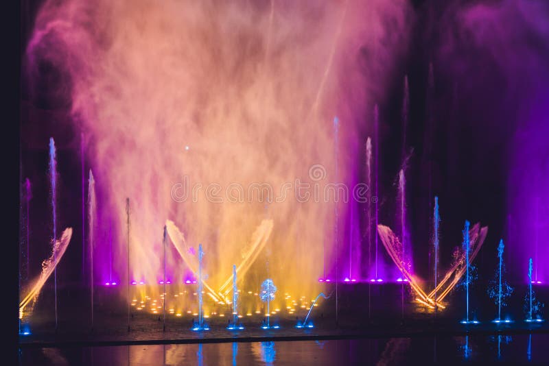 Multicolored Dancing Water Jet Fountain in the Dark Editorial Stock ...