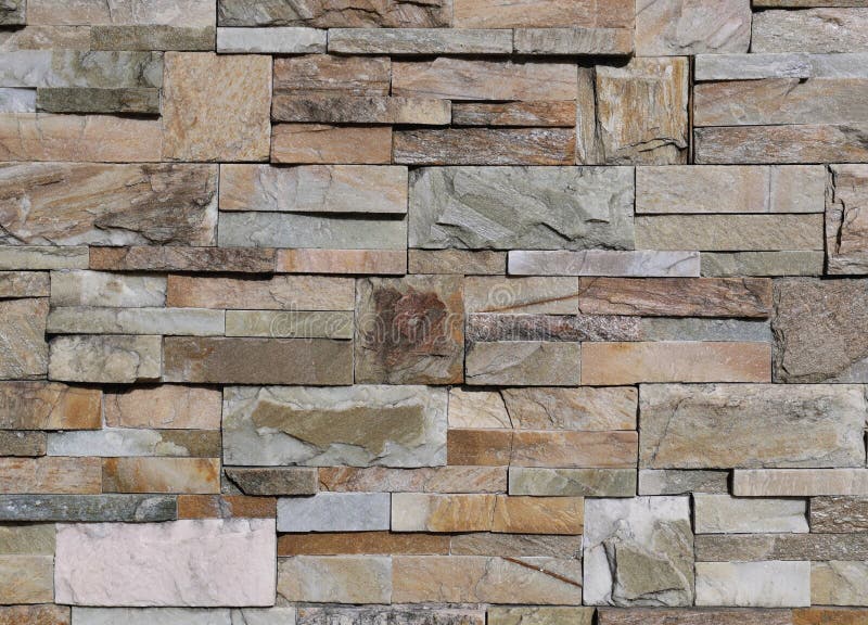 Multicolored External Wall Made of Different Types of Rocks with ...