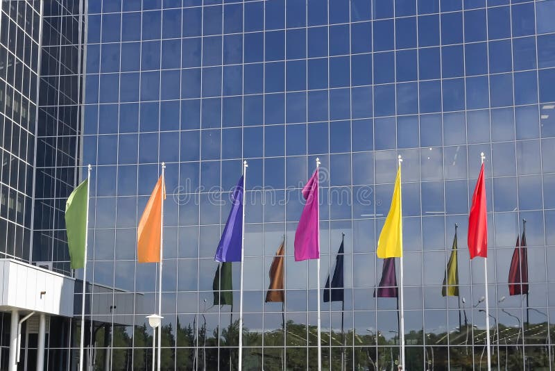 Multicolored Flags Against the Background of the Office Building Stock ...
