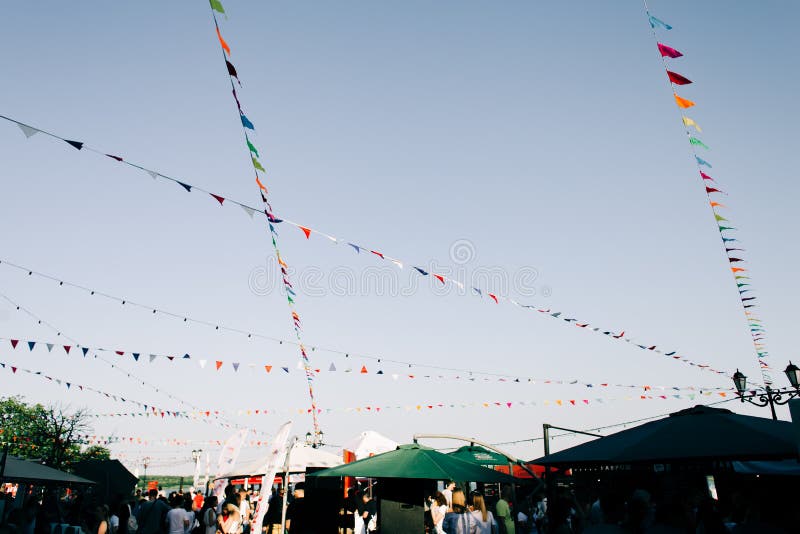 Multicolored Flags Flutter in the Wind Over a Street Fair Stock Image ...