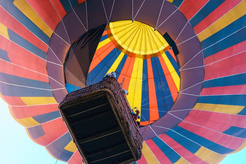 Multicolored Hot Air Balloon with Basket Rises into the Sky, Bottom ...
