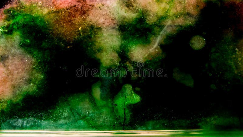 Multicolored Ice Plate Melting in Various Colors. Beautiful Ice ...