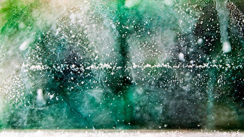 Multicolored Ice Plate Melting in Various Colors. Beautiful Ice ...