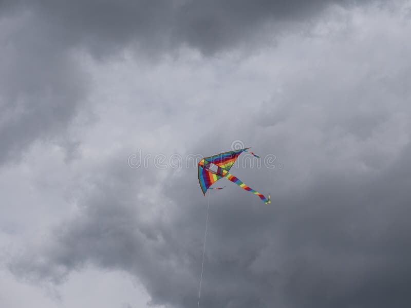 Red Kite Soaring with Wings Outstretched Against a Cloudy Sky. Stock ...