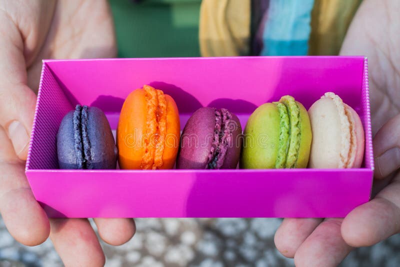 Multicolored Macaroon Cake in a Pink Box in the Han Stock Image - Image ...