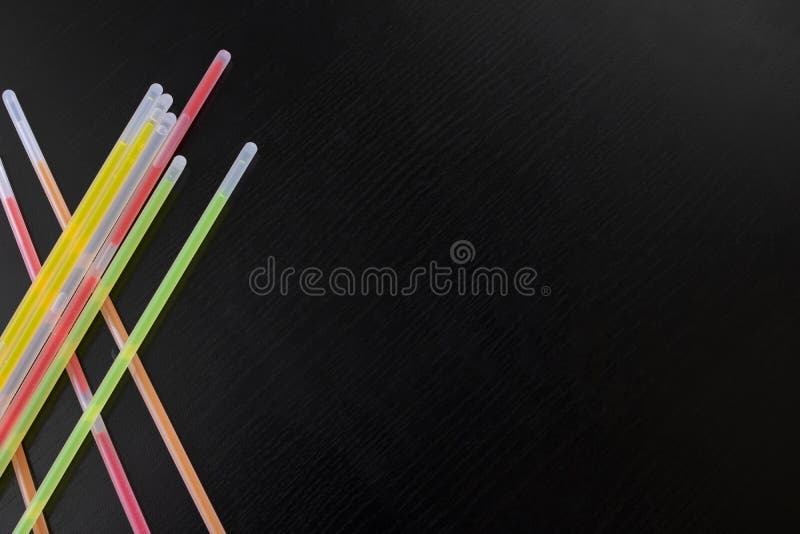 Multicolored Neon Sticks on a Wooden Background Stock Photo - Image of ...