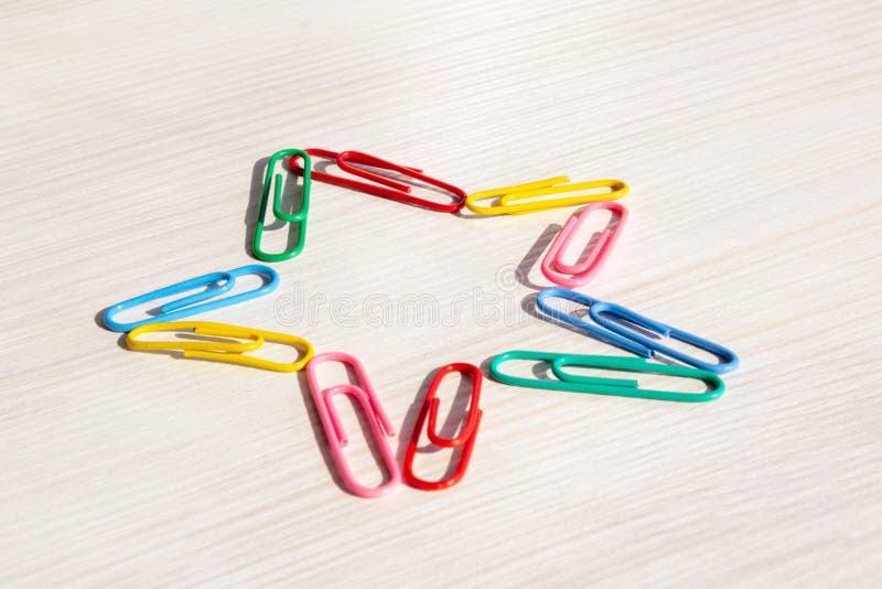 Multicolored Paper Clips. Paper Clip Star on a Light Table. Star Close ...
