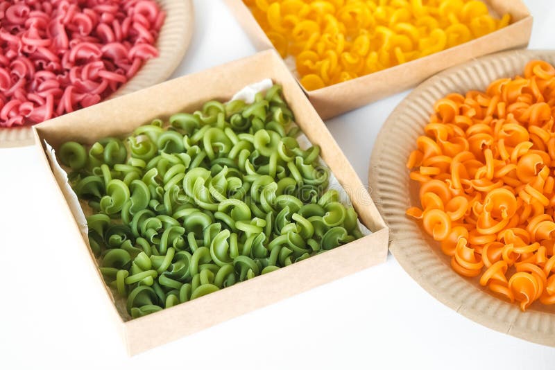 Multicolored Pasta in a Disposable Kraft Paper Plates and Boxes on a ...