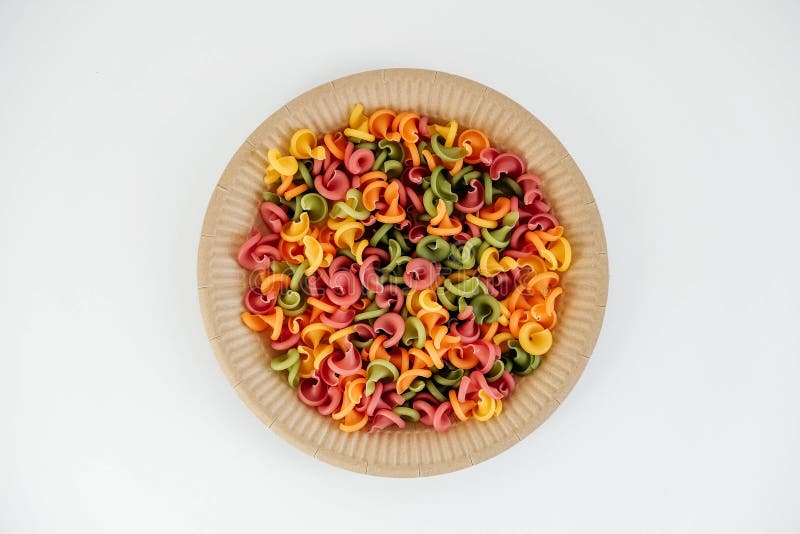 Multicolored Pasta in a Disposable Paper Plate on a White Background ...