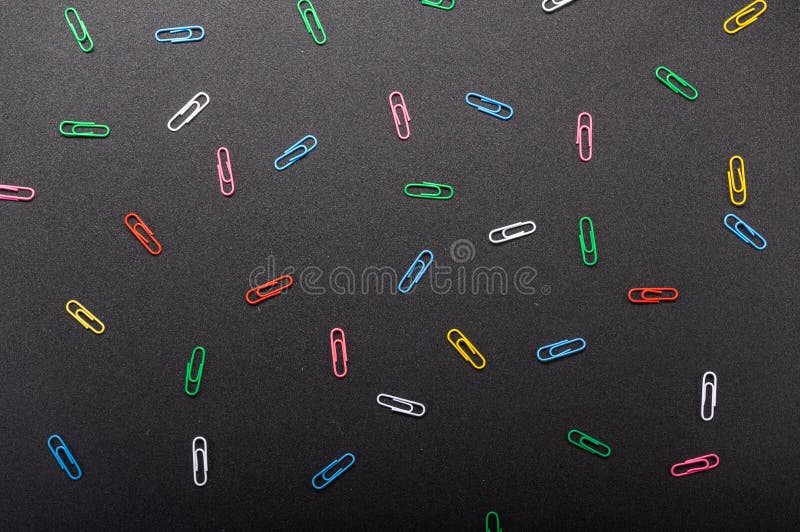 Multicolored Pattern on a Black Background. Multi-colored Paper Clips ...