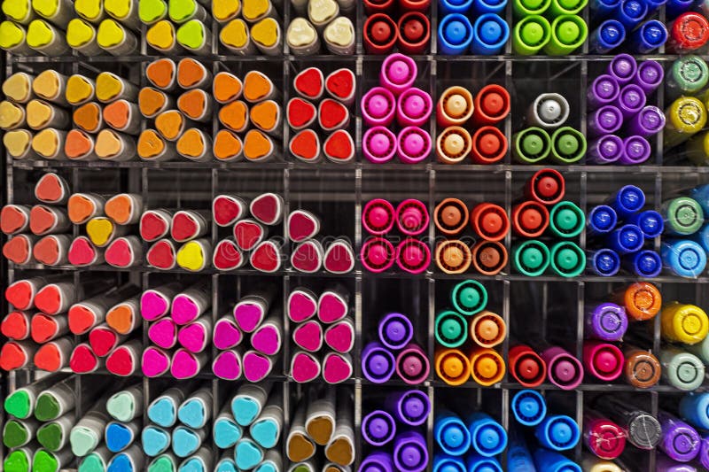 Multicolored Pens and Liners Arranged in Cells on a Shelf by Color ...