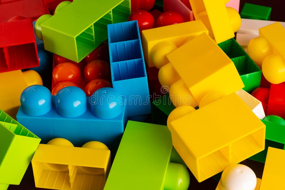 Multicolored Plastic Building Blocks of the Designer. Background of ...