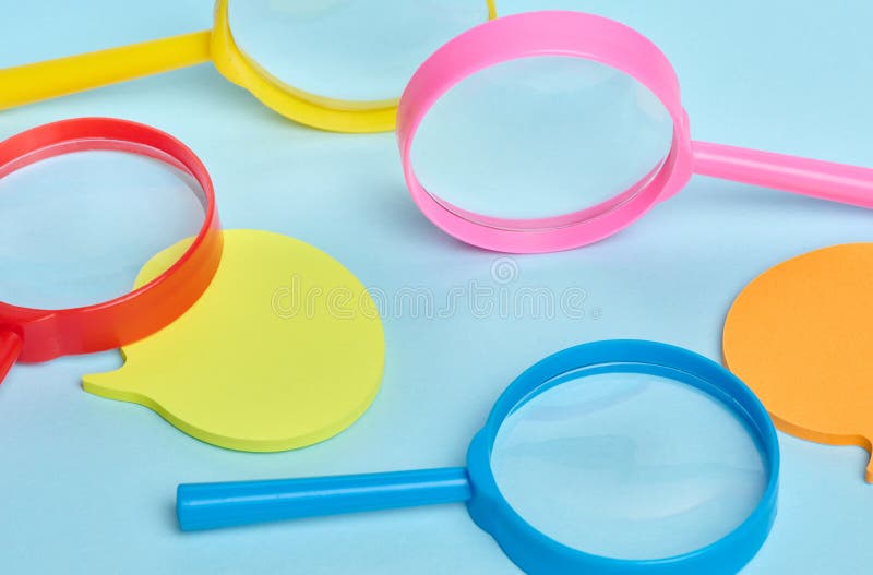 Multicolored Plastic Magnifying Glasses Blue Background Paper Notes ...
