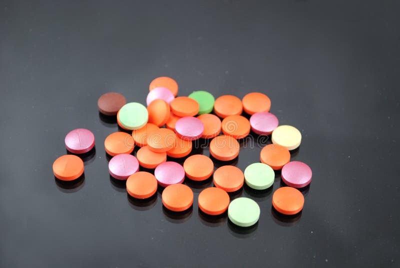 Multicolored round tablets stock image. Image of medication - 112383275