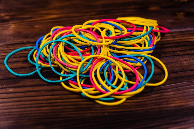 Multicolored Rubber Bands on Wooden Table Stock Photo - Image of ...