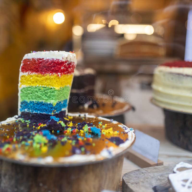 A Multicolored Slice of Cake Painted in Rainbow Colors on a Baking ...