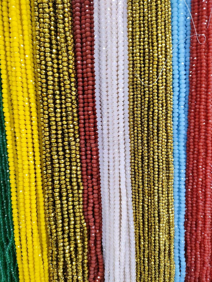 Multicolored Threads with Beads Hanging in Rows on the Wall Stock Photo ...