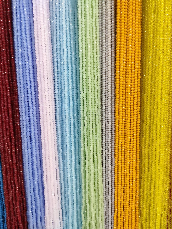 Multicolored Threads with Beads Hanging in Rows on the Wall Stock Image ...