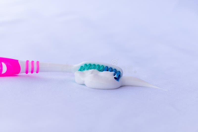 Multicolored Toothbrush with White Toothpaste Stock Photo - Image of ...