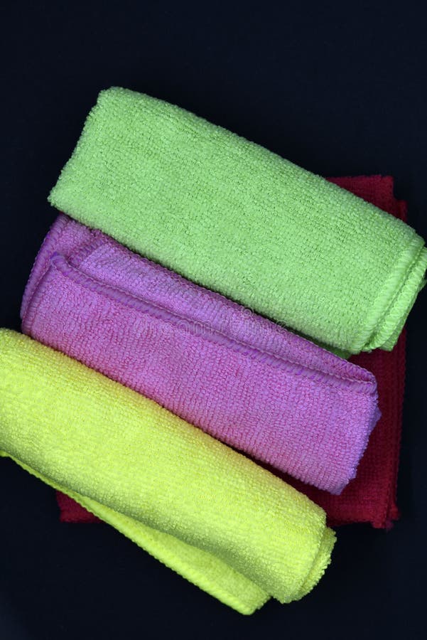 Multicolored Towels on a Black Background. Terry Towels. Colored Rags ...