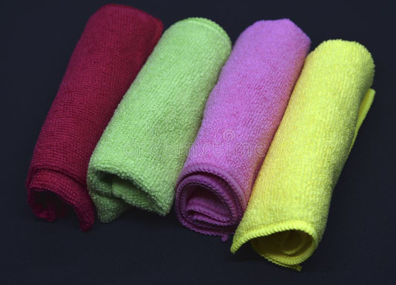 Multicolored Towels on a Black Background. Terry Towels. Colored Rags ...