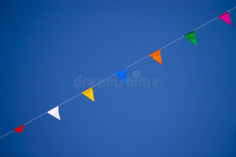 Multicolored Triangular Flags Hanging in the Sky at an Outdoor Stock ...