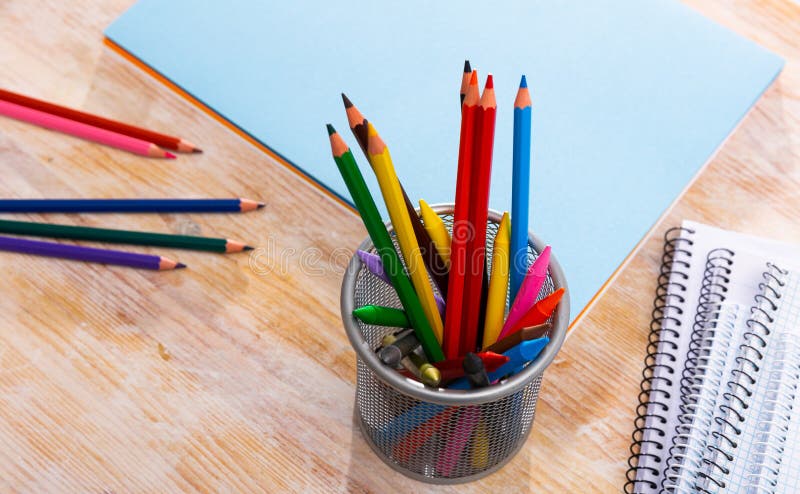 Multicolored Wooden Pencils on Desk with Papers and Notebooks Stock ...