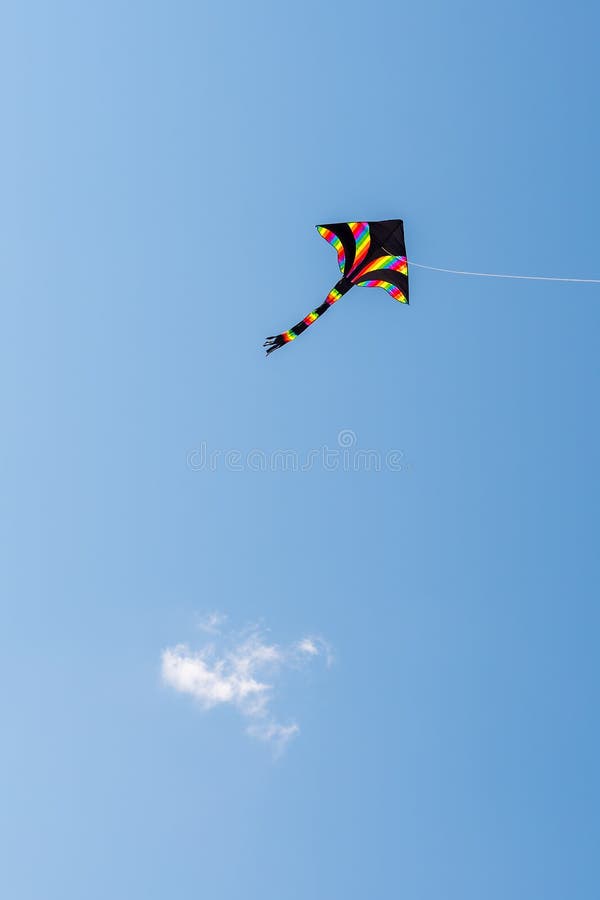 Multicoloured One-string Stunt Kite Against Sky. Delta-shape Kite Stock ...