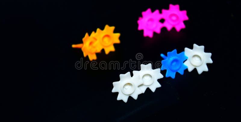 Multicoloured Small Plastic Objects on a Black Surface Stock Image ...