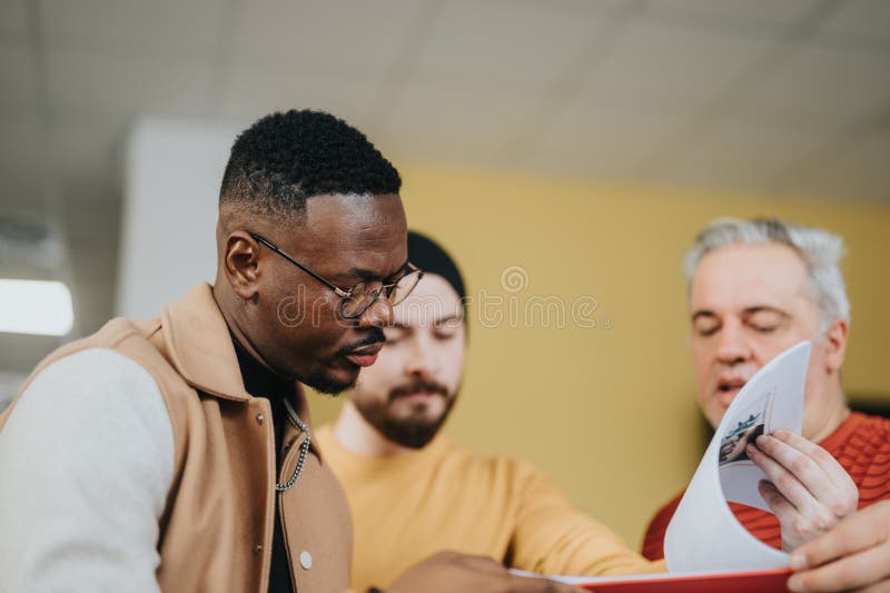 Multicultural Business Team Analyzing Statistics and Brainstorming ...
