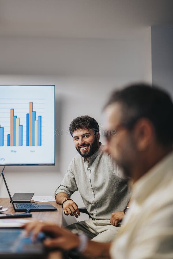 Multicultural Business Team Collaborating on Architectural Blueprint in ... Multicultural Business Team Collaborating on Architectural Blueprint in ...