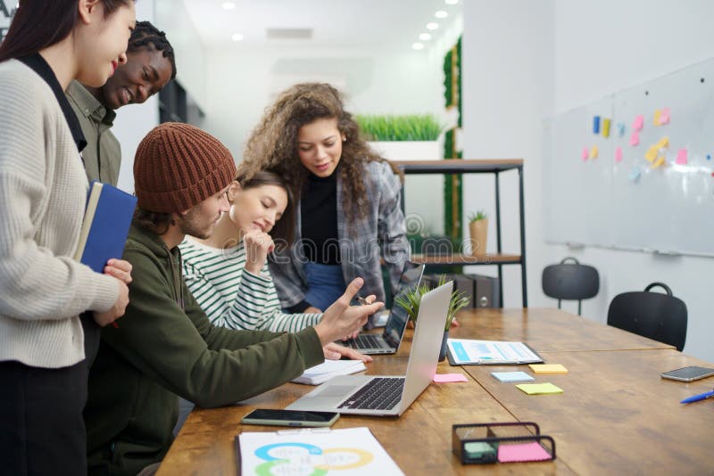 Multicultural Business Team Discussing Current Tasks for a New Project ...