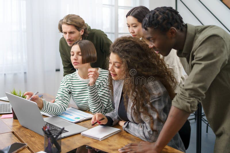 Multicultural Business Team Discussing Current Tasks for a New Project ...