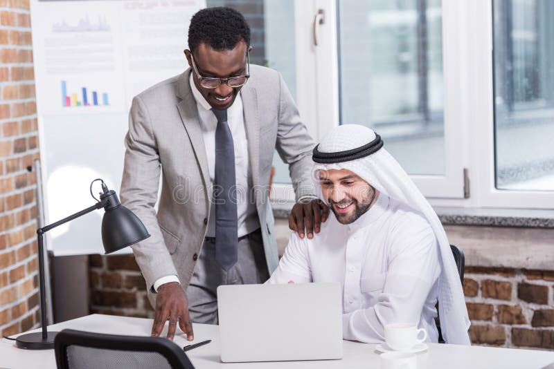 Multicultural Businessmen Looking at Computer Stock Image - Image of ...