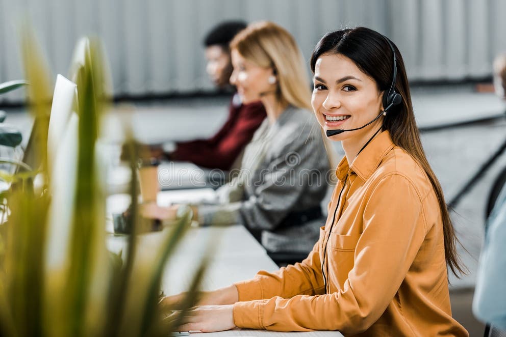 Multicultural Call Center Operators with Headsets at Workpalce Stock ...