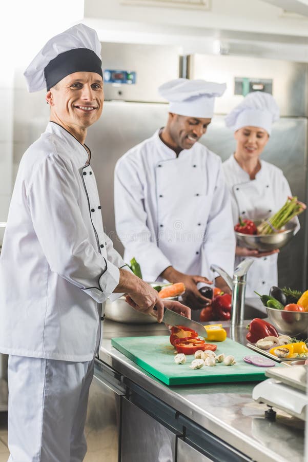 Multicultural Chefs Cutting and Washing Vegetables Stock Image - Image ...