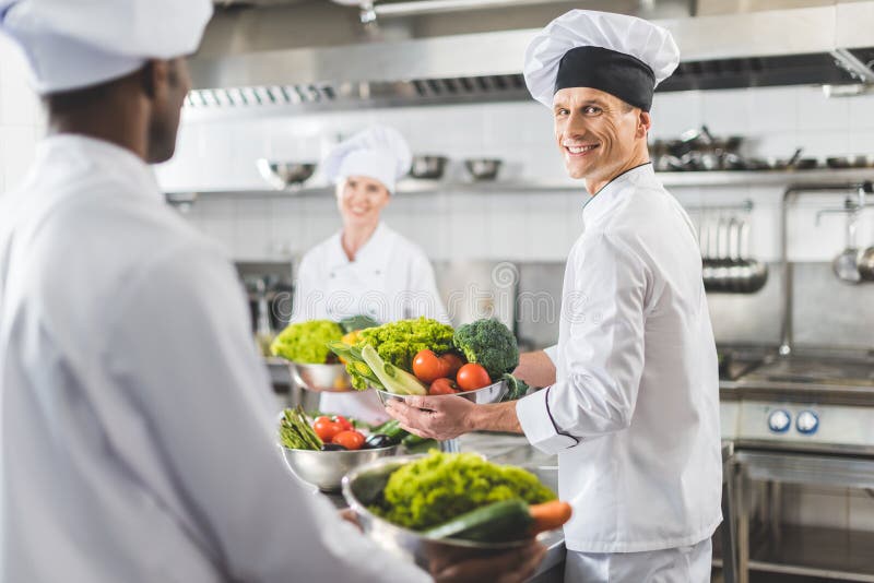 Multicultural Chefs Holding Bowls with Vegetables Stock Image - Image ...