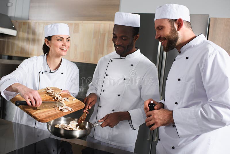 Multicultural Chefs Preparing Mushrooms Stock Photo - Image of ...