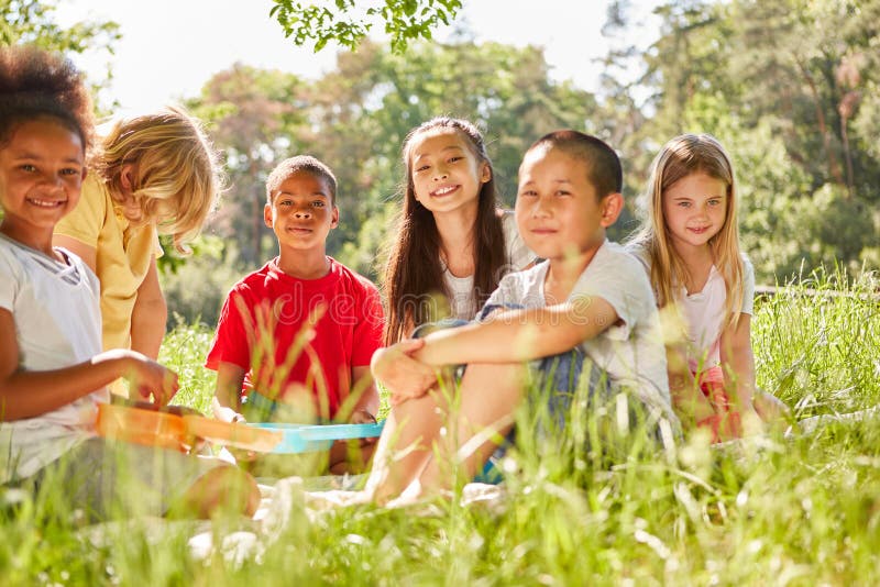Multicultural Children Group at a Picnic Stock Photo - Image of nature ...