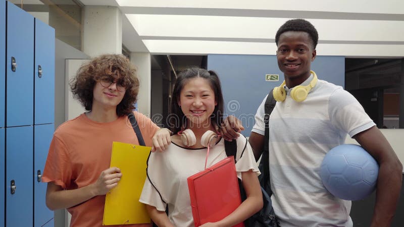 Multicultural Classmates Talking To Each Other at Break of Classes in ...