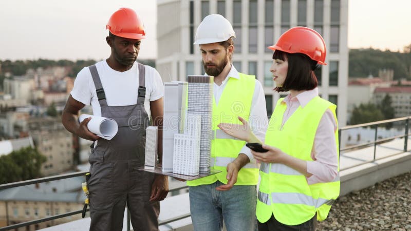 Multicultural Designers with Equipment Posing on Rooftop Stock Footage ...