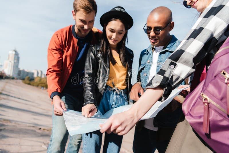 Multicultural Friends Choosing Destination on Map Stock Image - Image ...