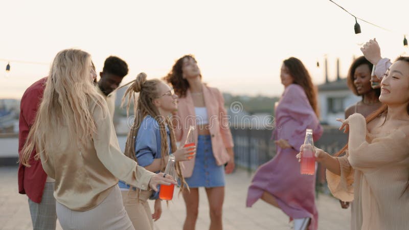 Multicultural Friends Dancing and Drinking on Rooftop Party Stock Video ...