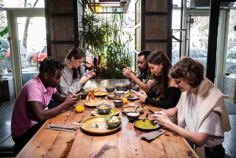 A Multicultural Group of Friends Having a Breakfast in the Cafe Stock ...