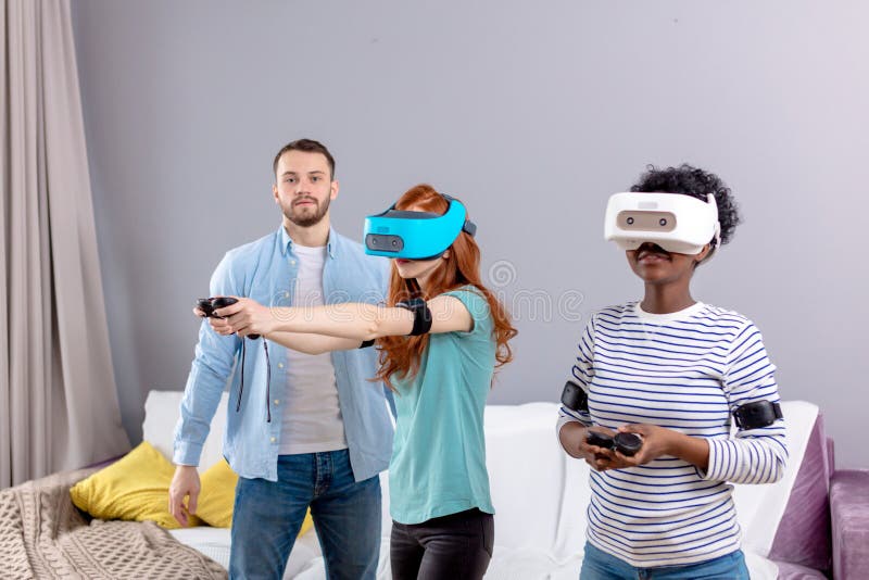 Multicultural Group of Friends Playing Games Using Virtual Reality ...