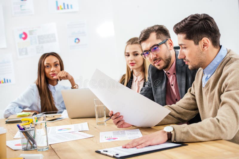 Multicultural Group of Marketing Managers Working on Project Together ...