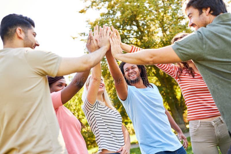Multicultural Group of Young People High Five Stock Photo - Image of ...