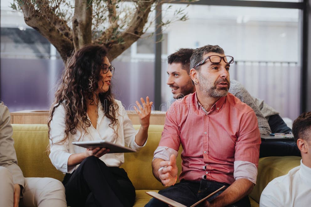 Multicultural and Inter Generational Colleagues Collaborate in a Modern ...